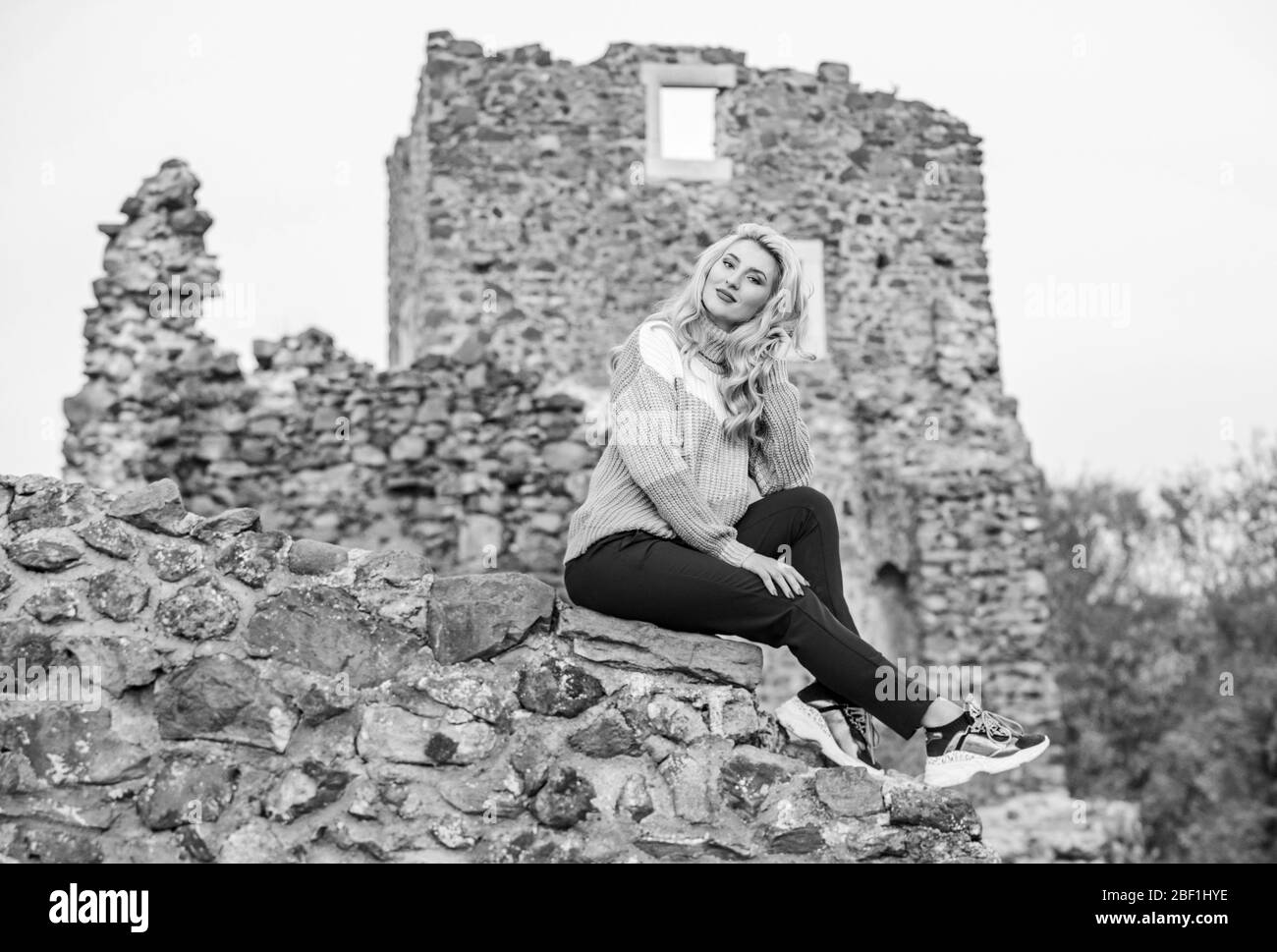 Travel destinations. Woman makeup face sit on stony ruins background ...