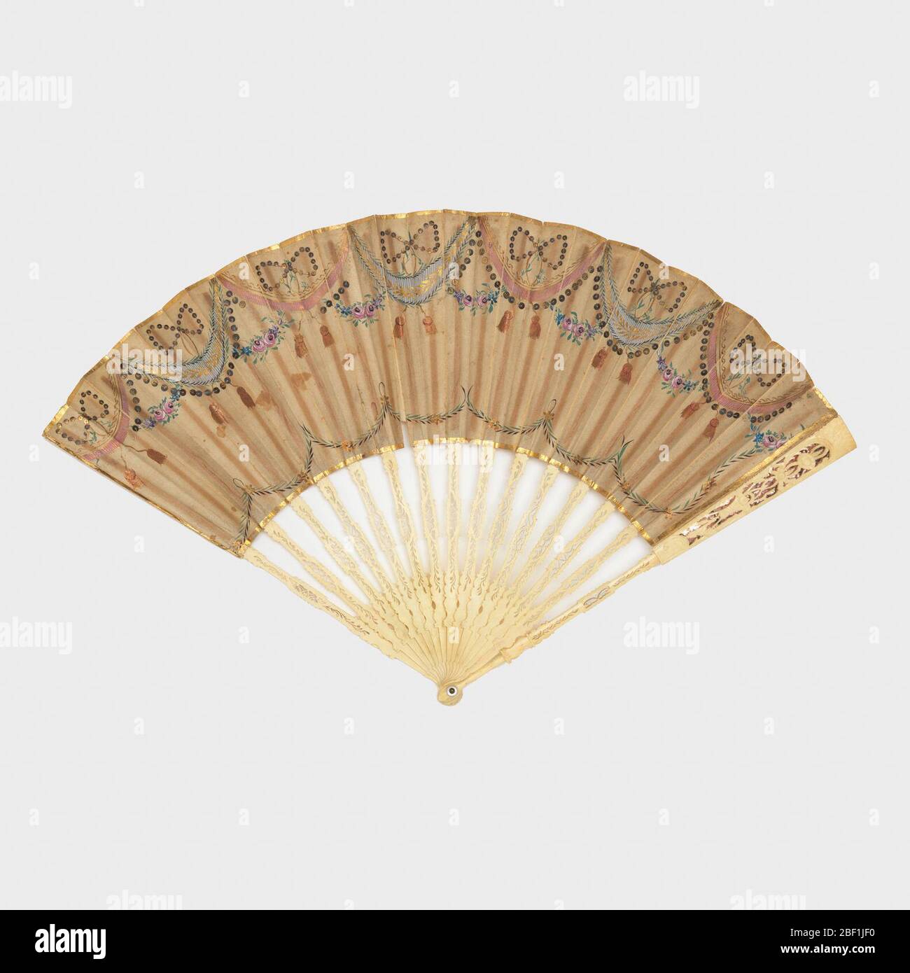 Folding fan and case. Folding fan with carved and pierced bone sticks ...