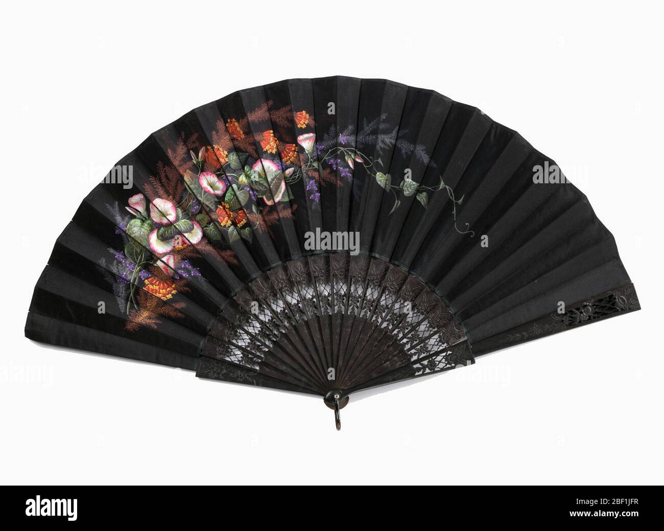 Pleated fan. Pleated fan. Black silk leaf painted with a design of ...