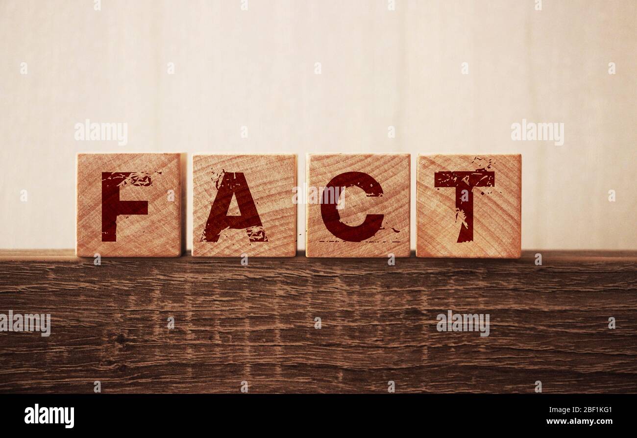 FACT Word Written In Wooden Cube. Fake and real fact and news concept ...