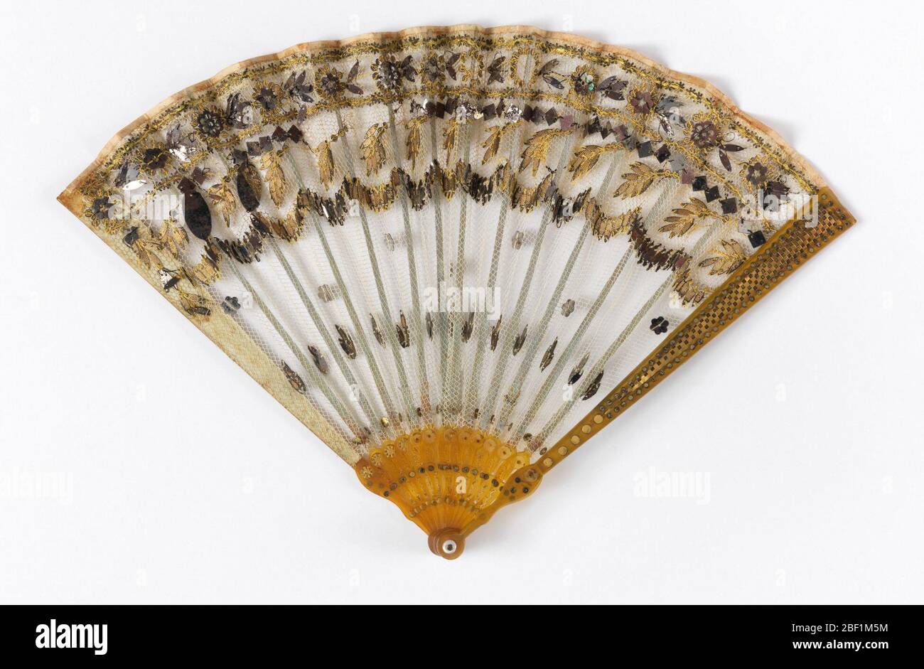 Pleated fan. Pleated fan. Leaf is a single layer of white net, obverse ...