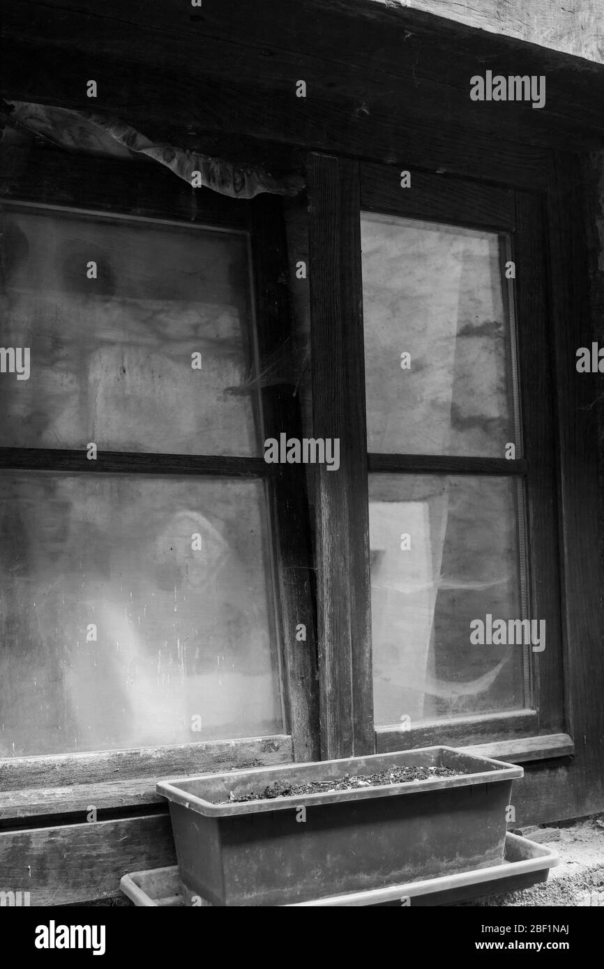 A wooden window of an old house with spider web and worn glass Stock ...