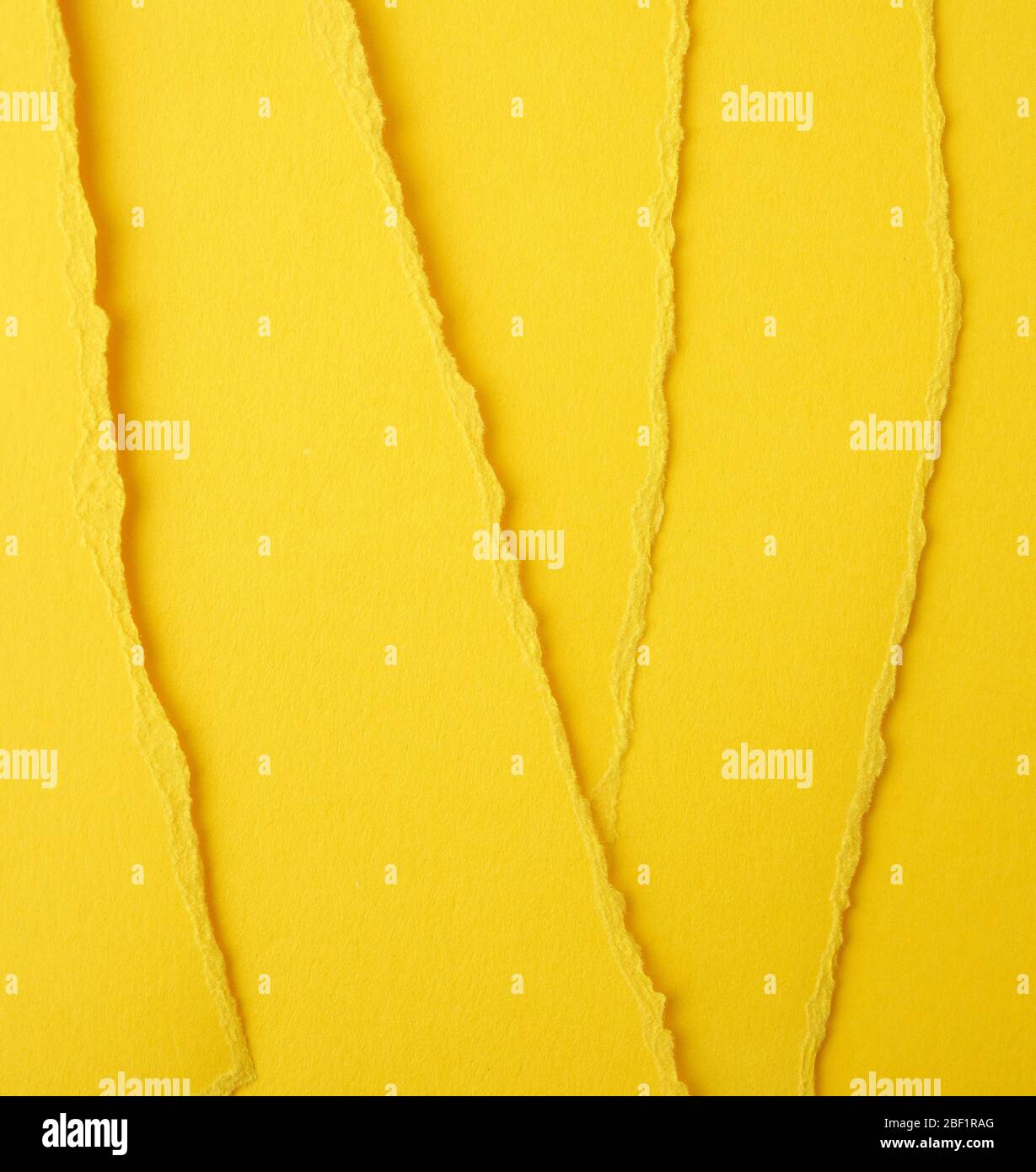 background of layered yellow torn paper with a shadow, backdrop and ...