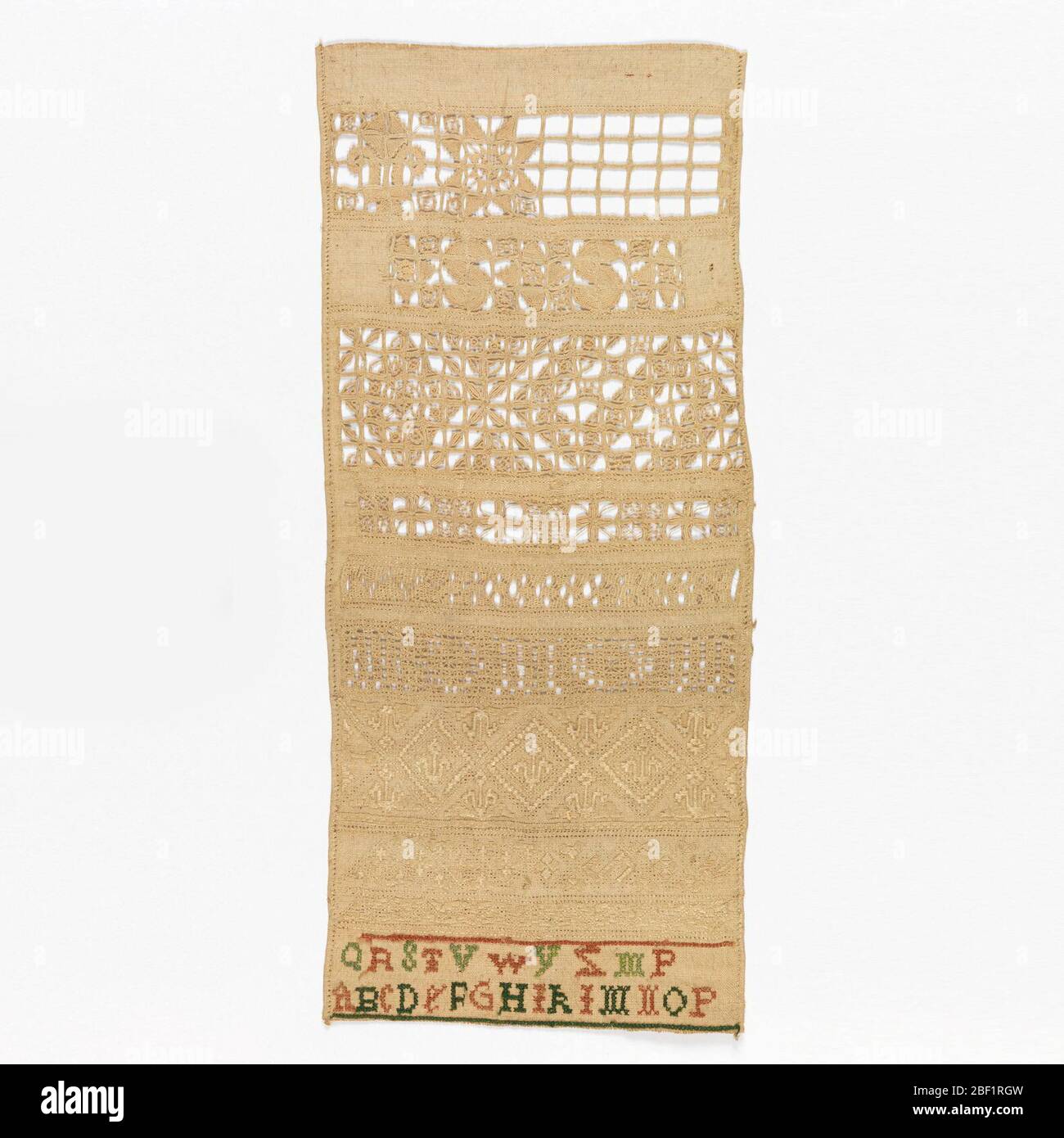 Sampler. Part of an unfinished white work sampler. Bands of pattern ...