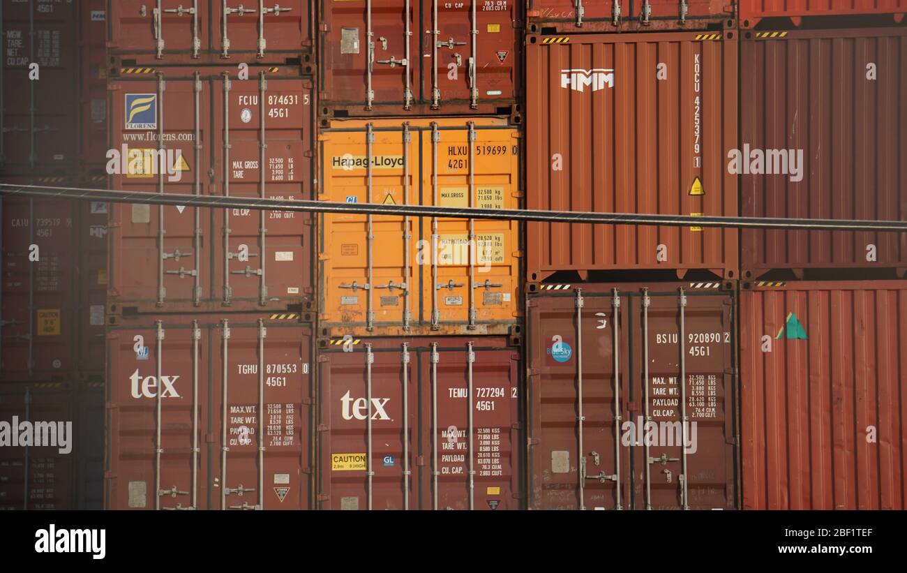 International shipping container terminal. Stacks of intermodal containers used for global trade ...