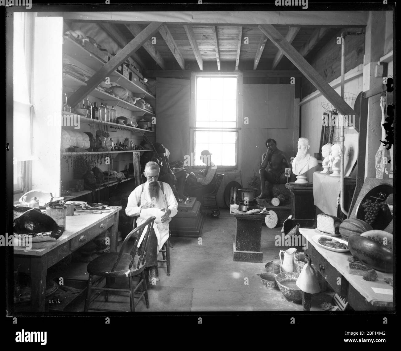Sculptor John W Hendley in Modelers Studio. Also known as 3678.See also ...