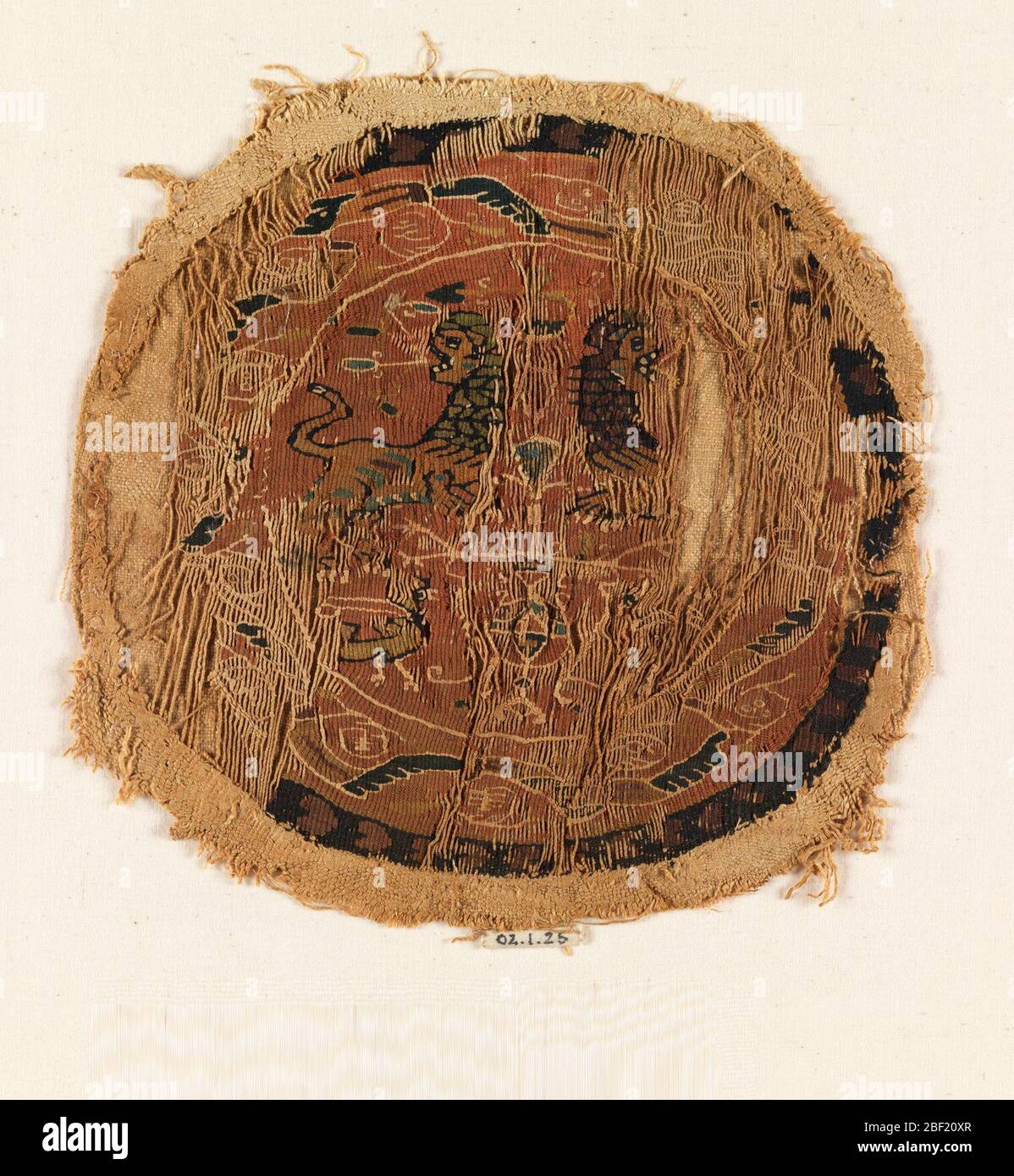 Medallion. Multicolored roundel depicting two lions and a bird flanking ...