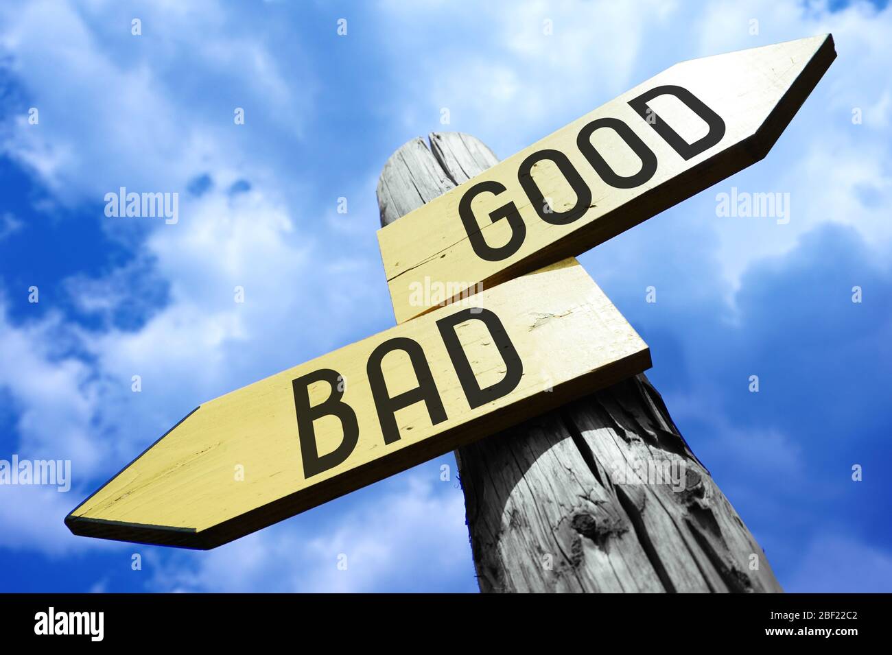 Good, bad - wooden signpost Stock Photo - Alamy