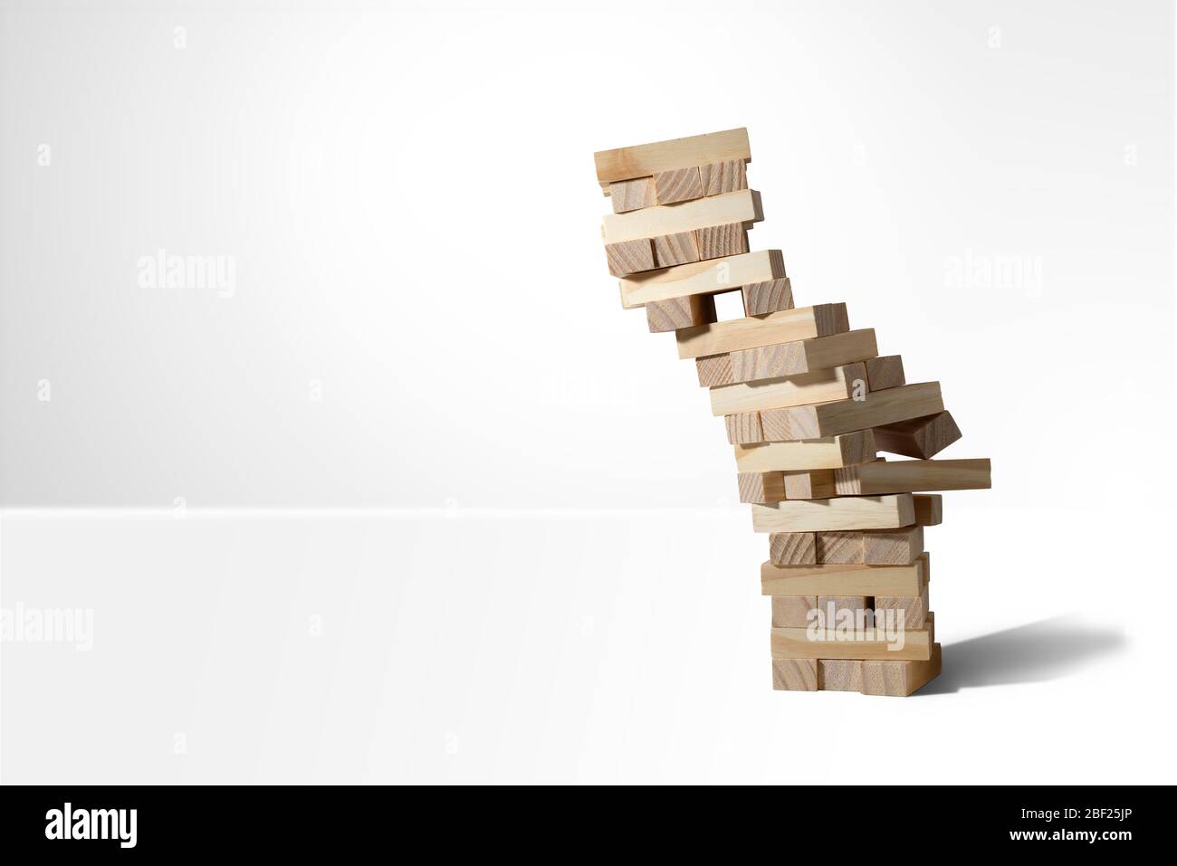 Wooden block tower game collapses isolated on white background with ...