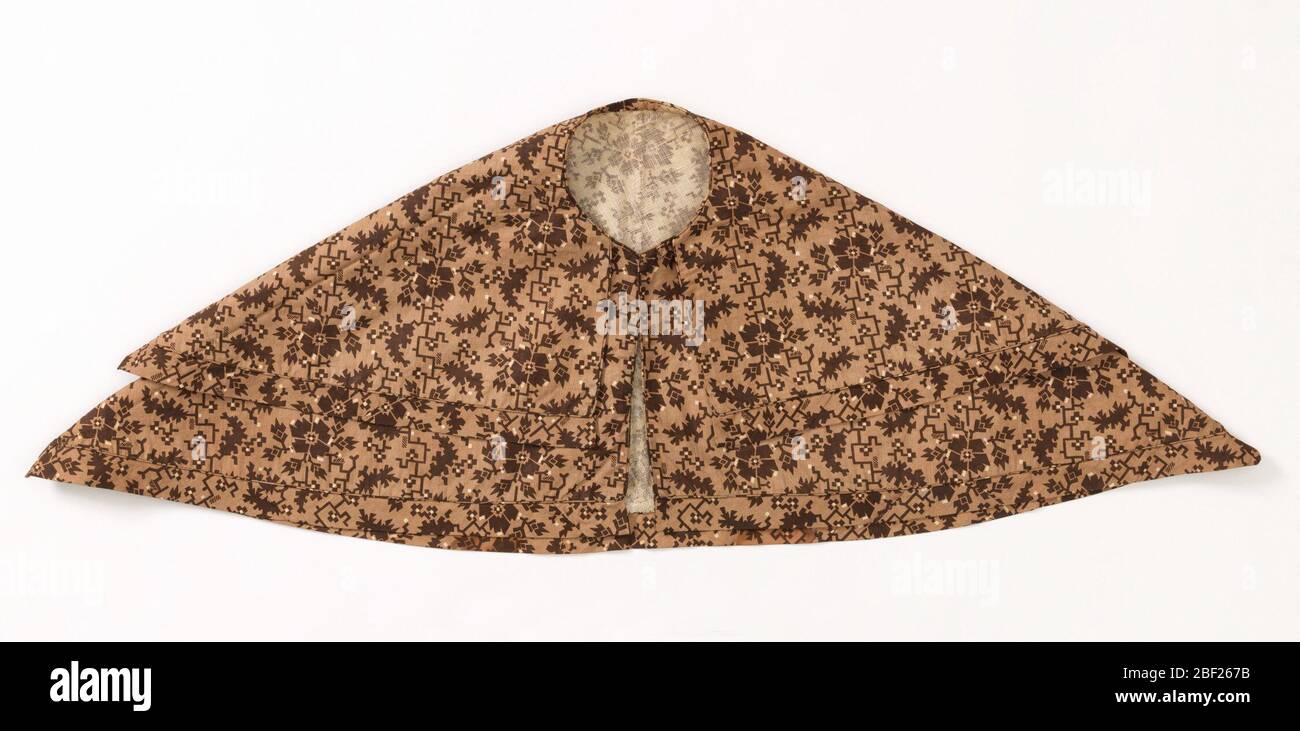 Cape. Short, square-cut double shoulder cape in brown and white. Design ...