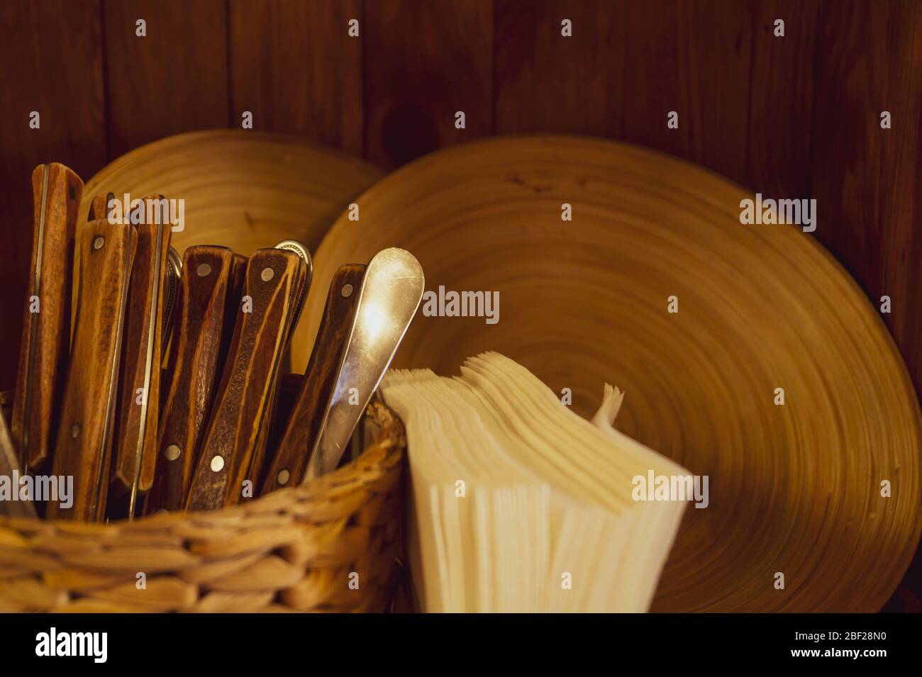 Cutlery and wooden plates. old fashioned utensil Stock Photo - Alamy