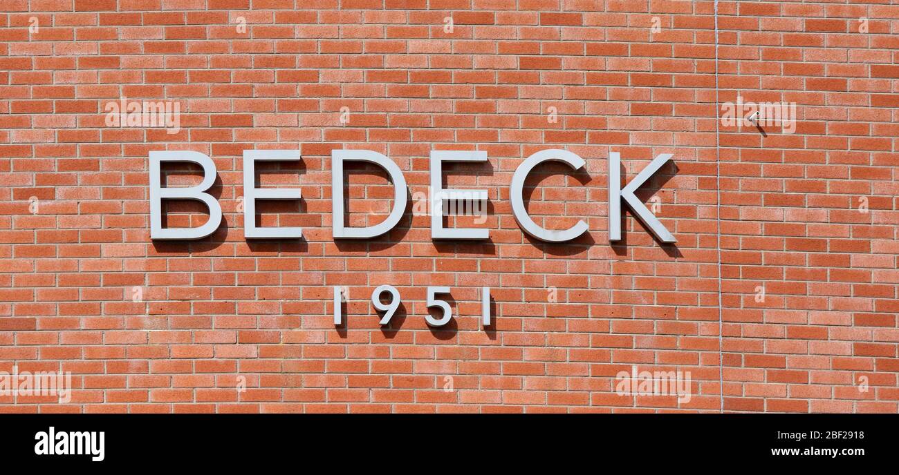 Wall-mounted lettering for Bedeck 1951 on a red brick wall exterior of ...