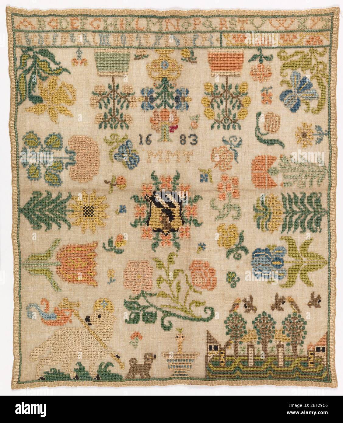 Sampler. Alphabet at top, plants growing from three edges. In the ...