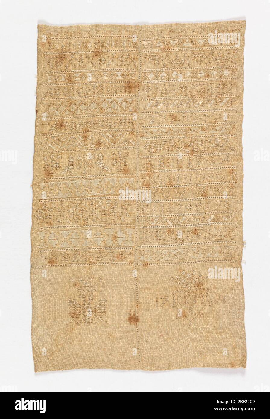 Sampler. Bands of white work vertically divided into two columns. At ...
