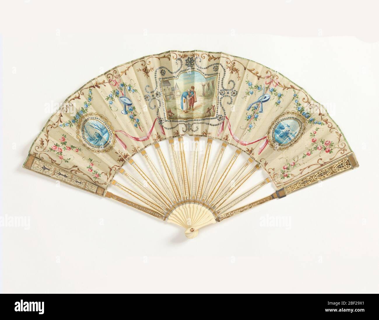 Pleated fan. Pleated fan with painted silk leaf showing background of ...