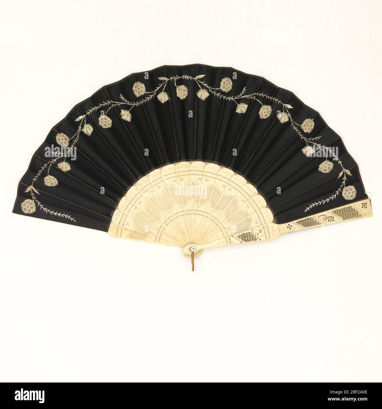 Pleated fan. Pleated fan with a black silk leaf with a simple ...