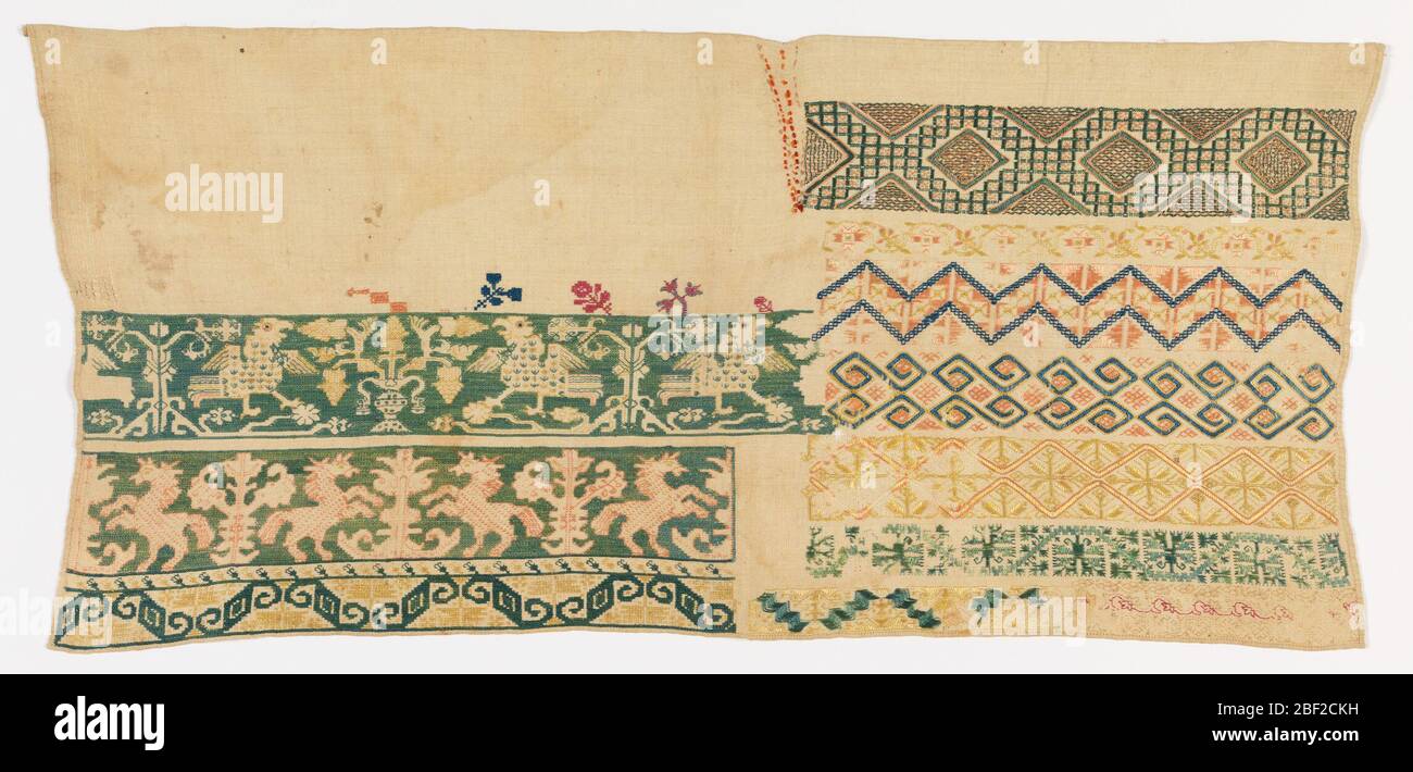 Sampler. Unfinished sampler embroidered in polychrome silks, with ...