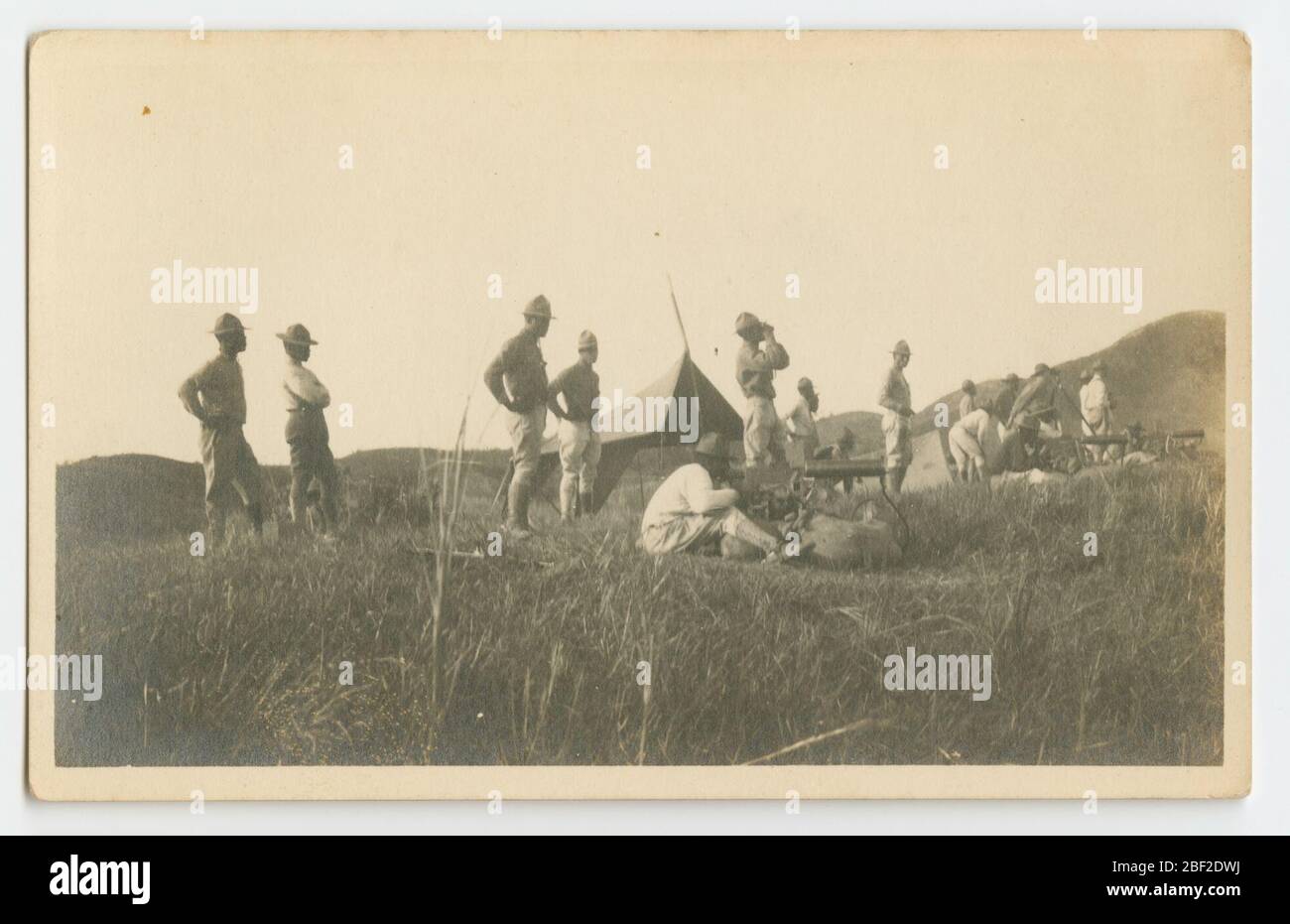Photographic postcard of Charles Wilbur Rogan with his unit in the ...