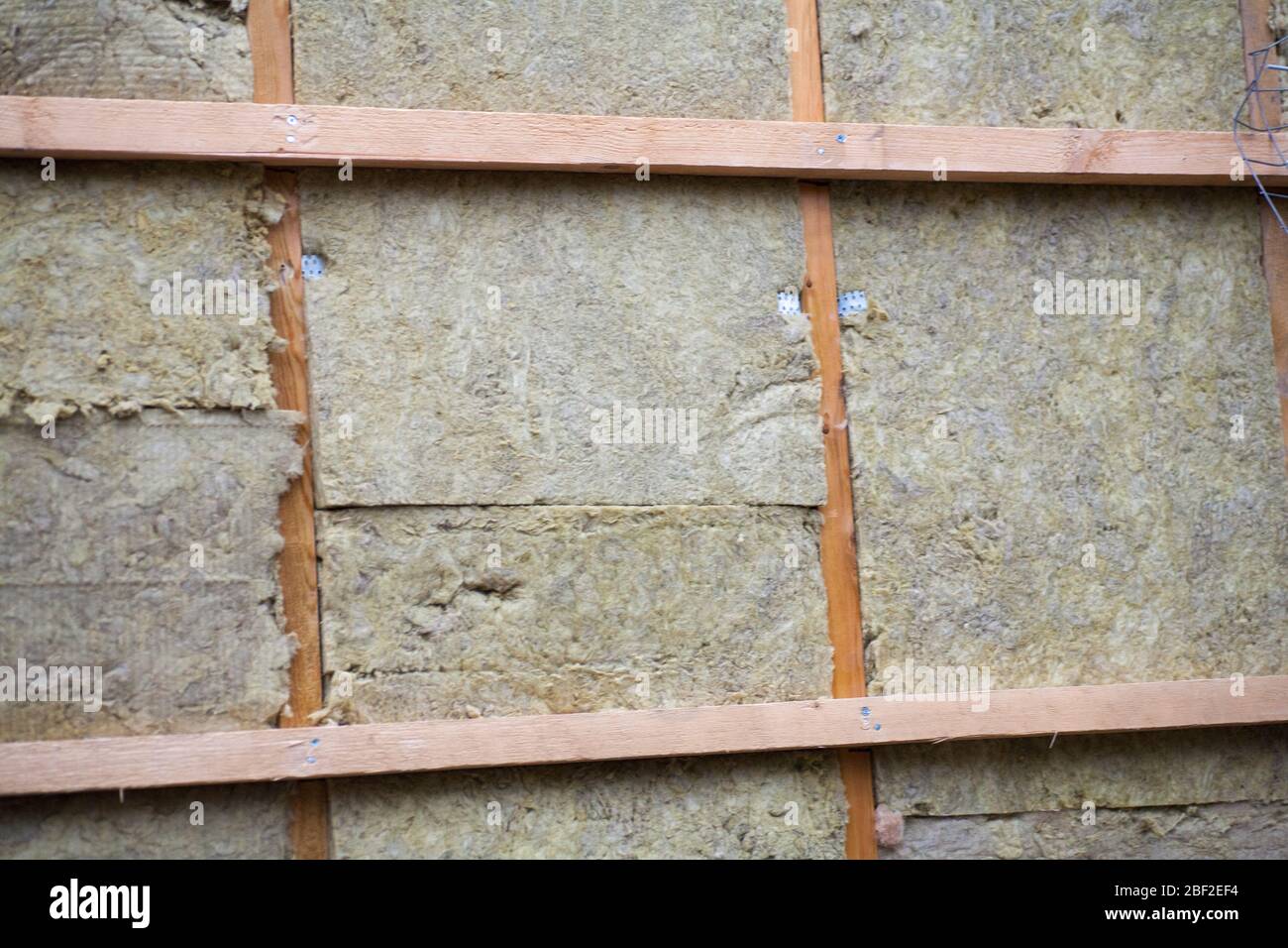 warming the walls of a stone house with a stone wool heater. Ecological ...