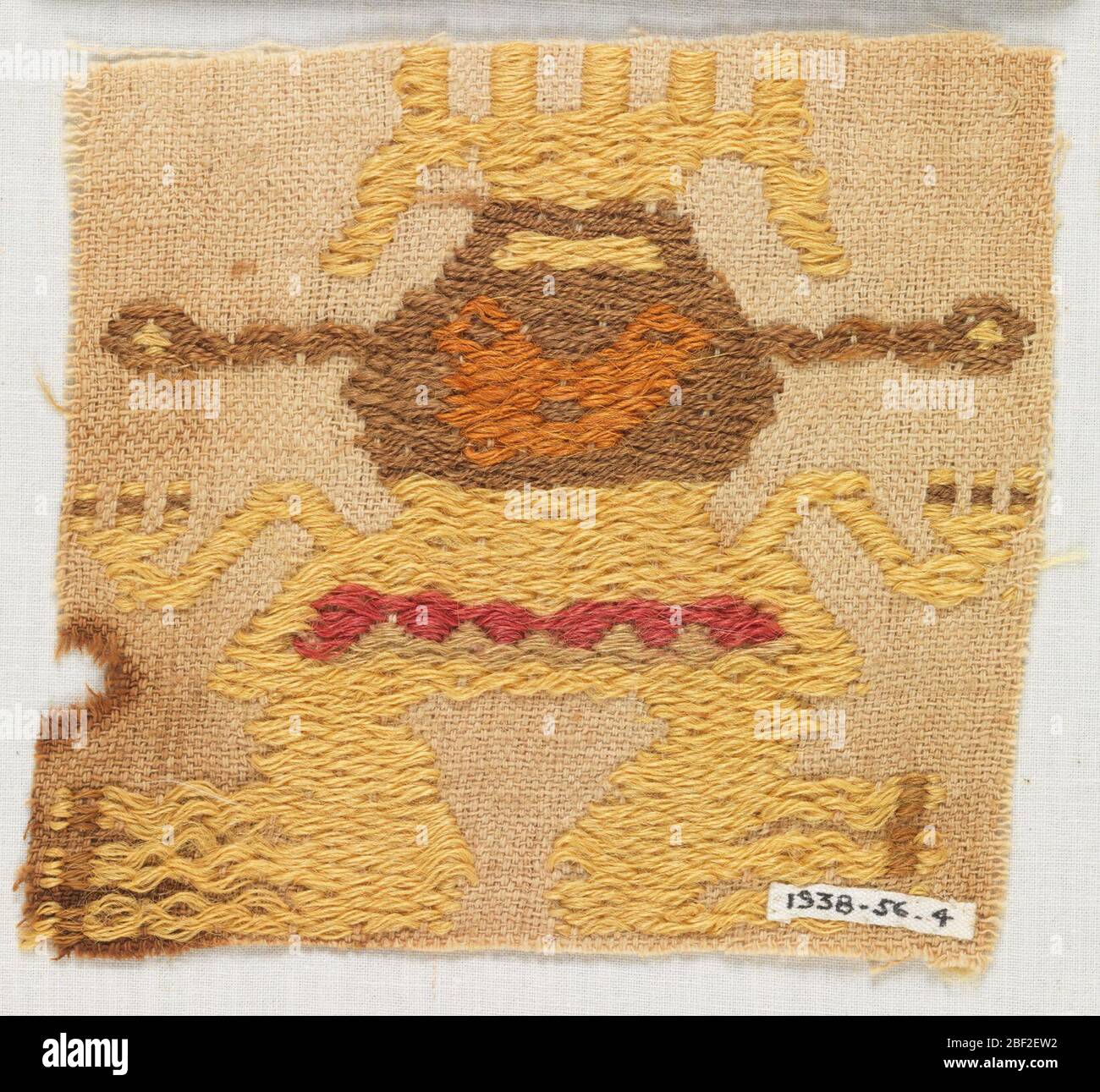 Fragment. Fragment of a funerary mantle in light brown cotton plain ...