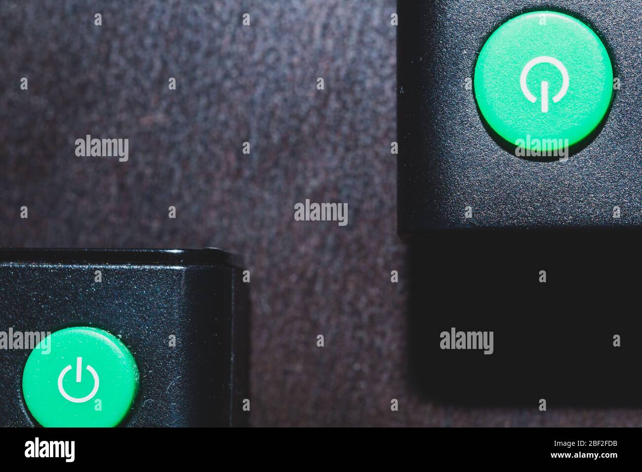Green power buttons on the remote control close up Stock Photo - Alamy
