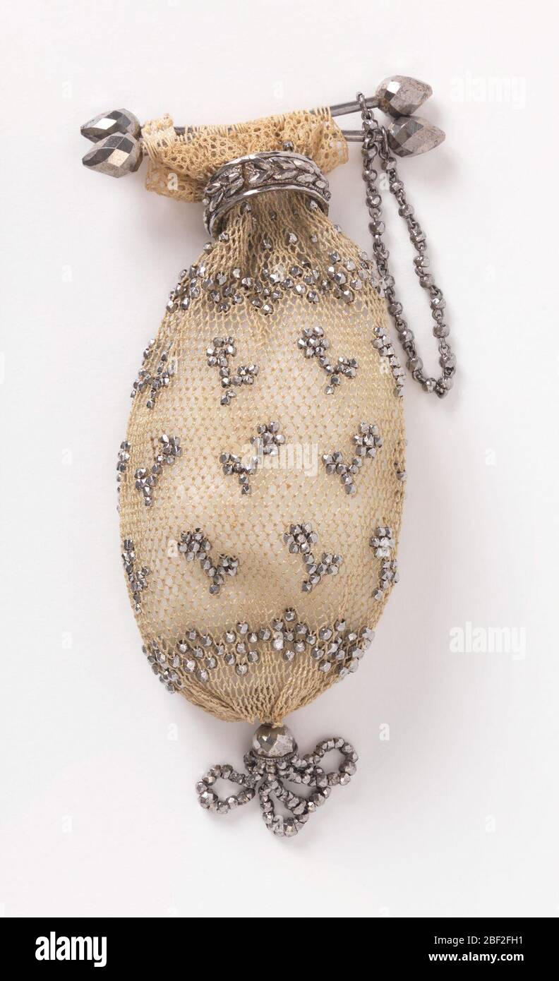 Purse. Small purse of white silk crocheted net with clusters of steel ...