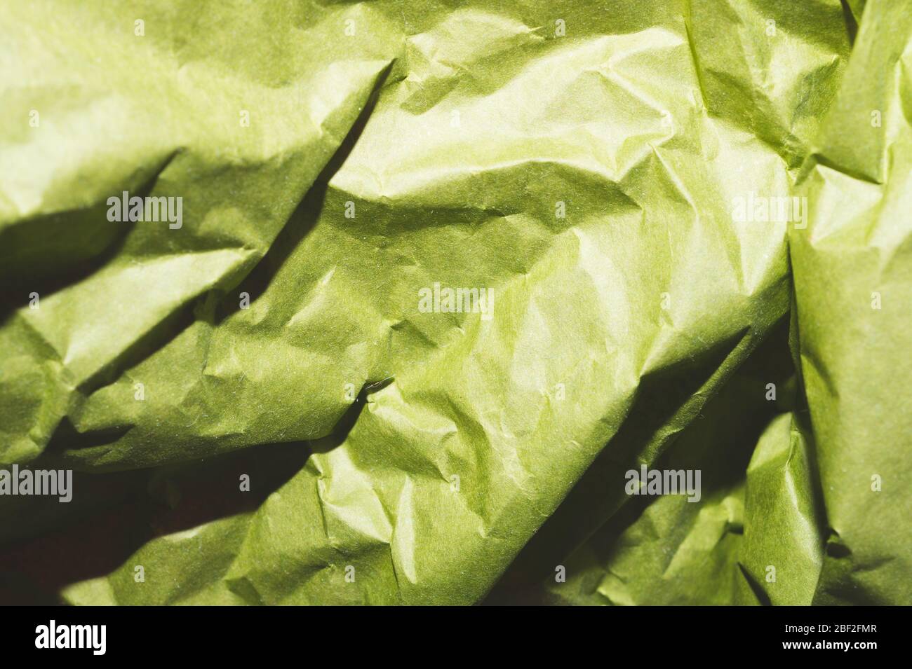 Crumpled green paper close up. creased kraft paper material Stock Photo ...