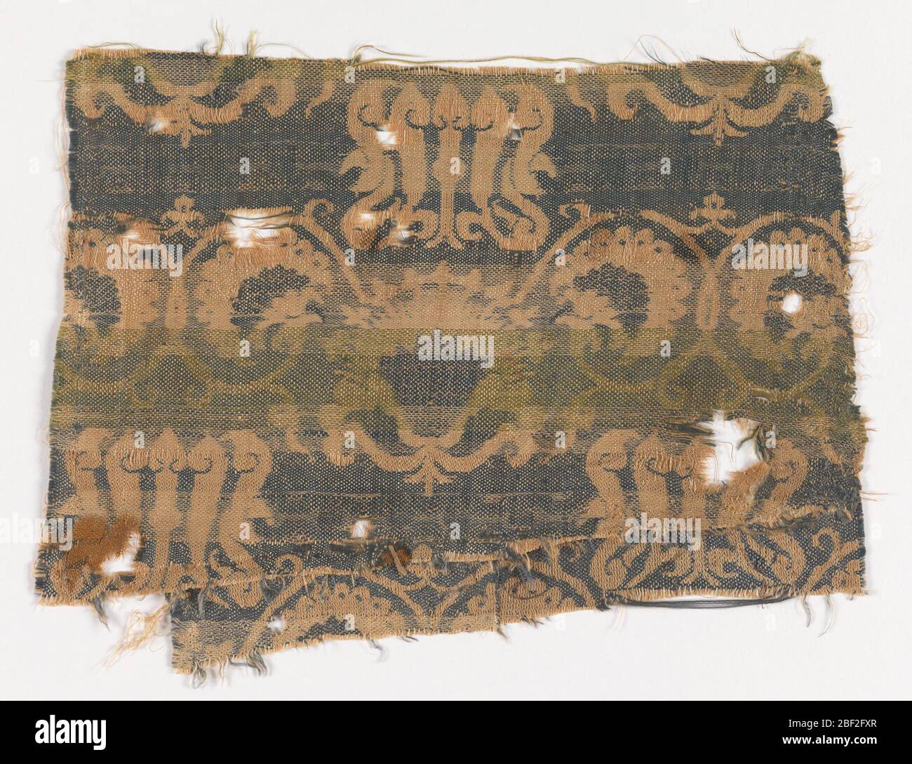 Fragment. Palmette flanked by circular scrolls with pseudo-Kufic ...