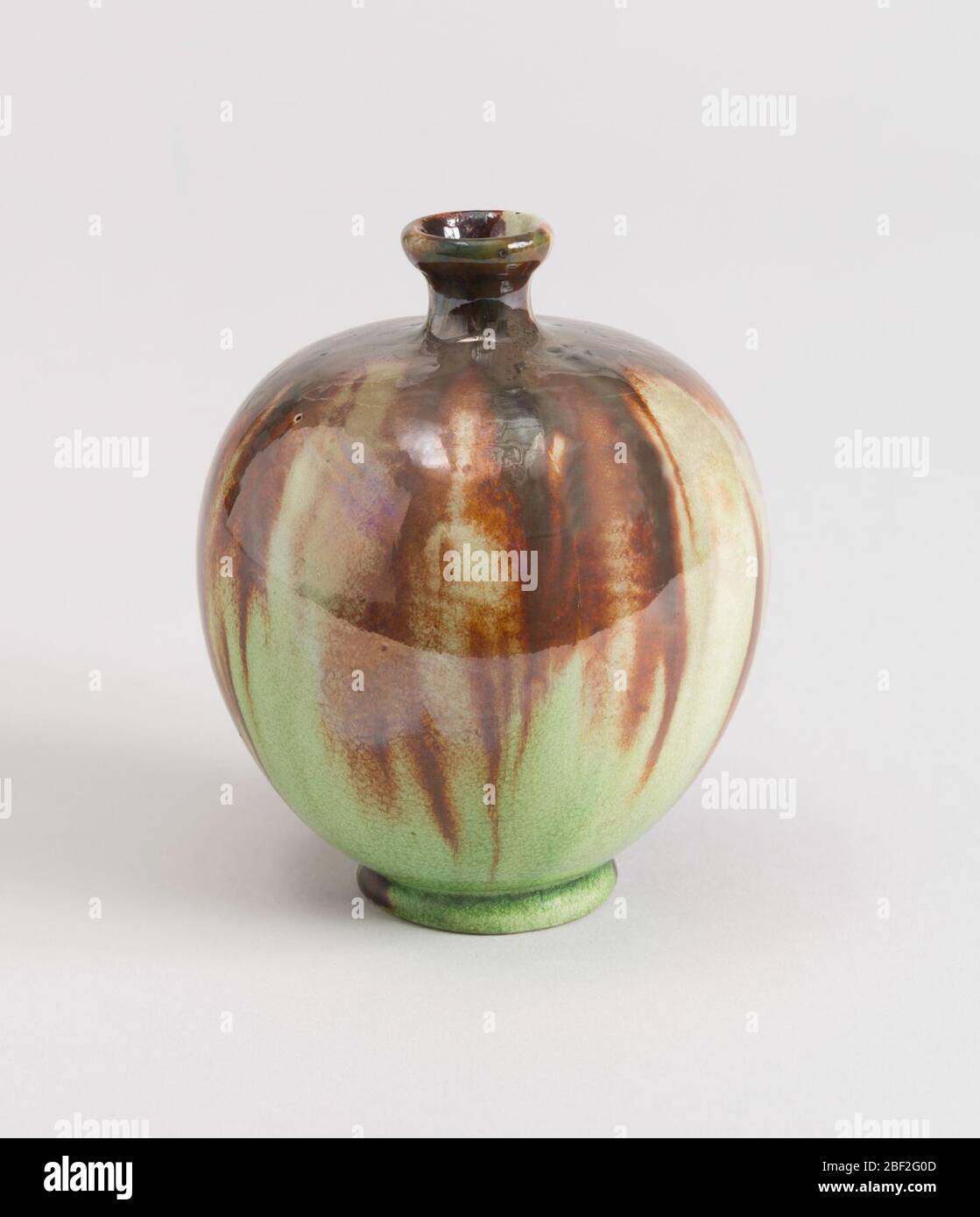 Vase. Vase in the form of an apple. Light-colored clay body, molded ...