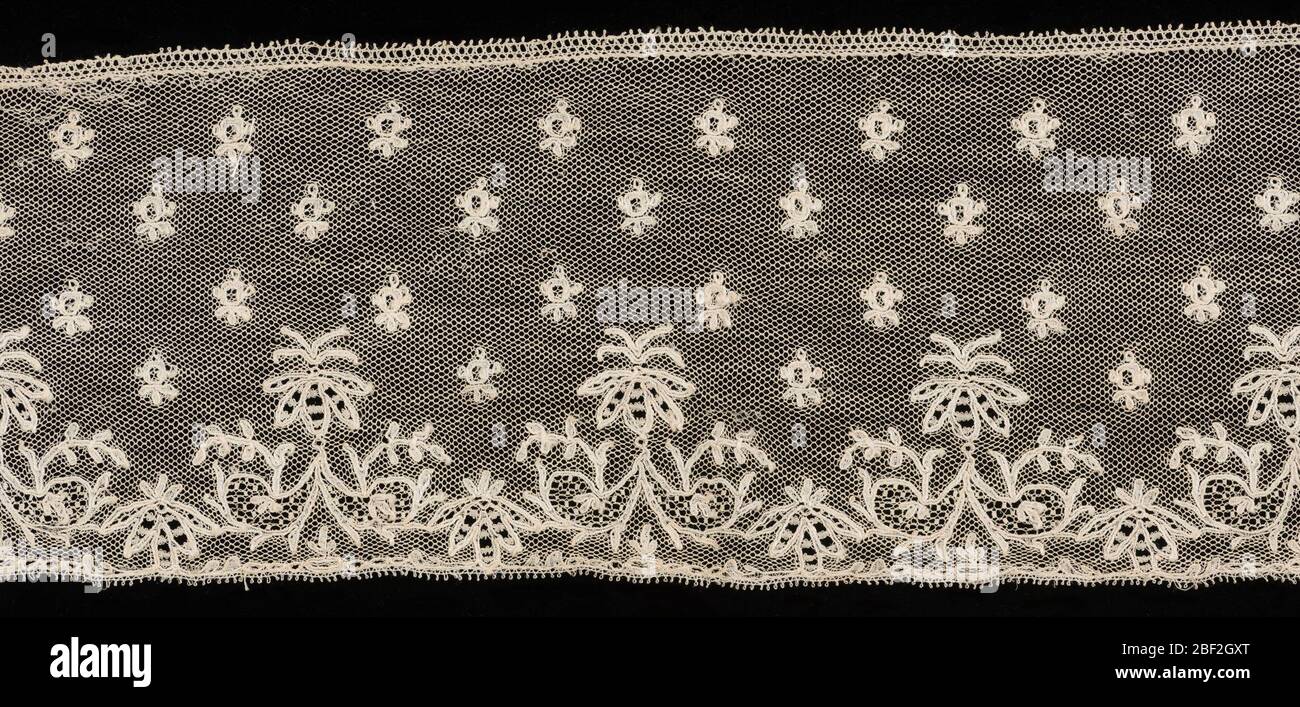 Border. Straight border of Mechlin lace with a design of buds sprinkled ...