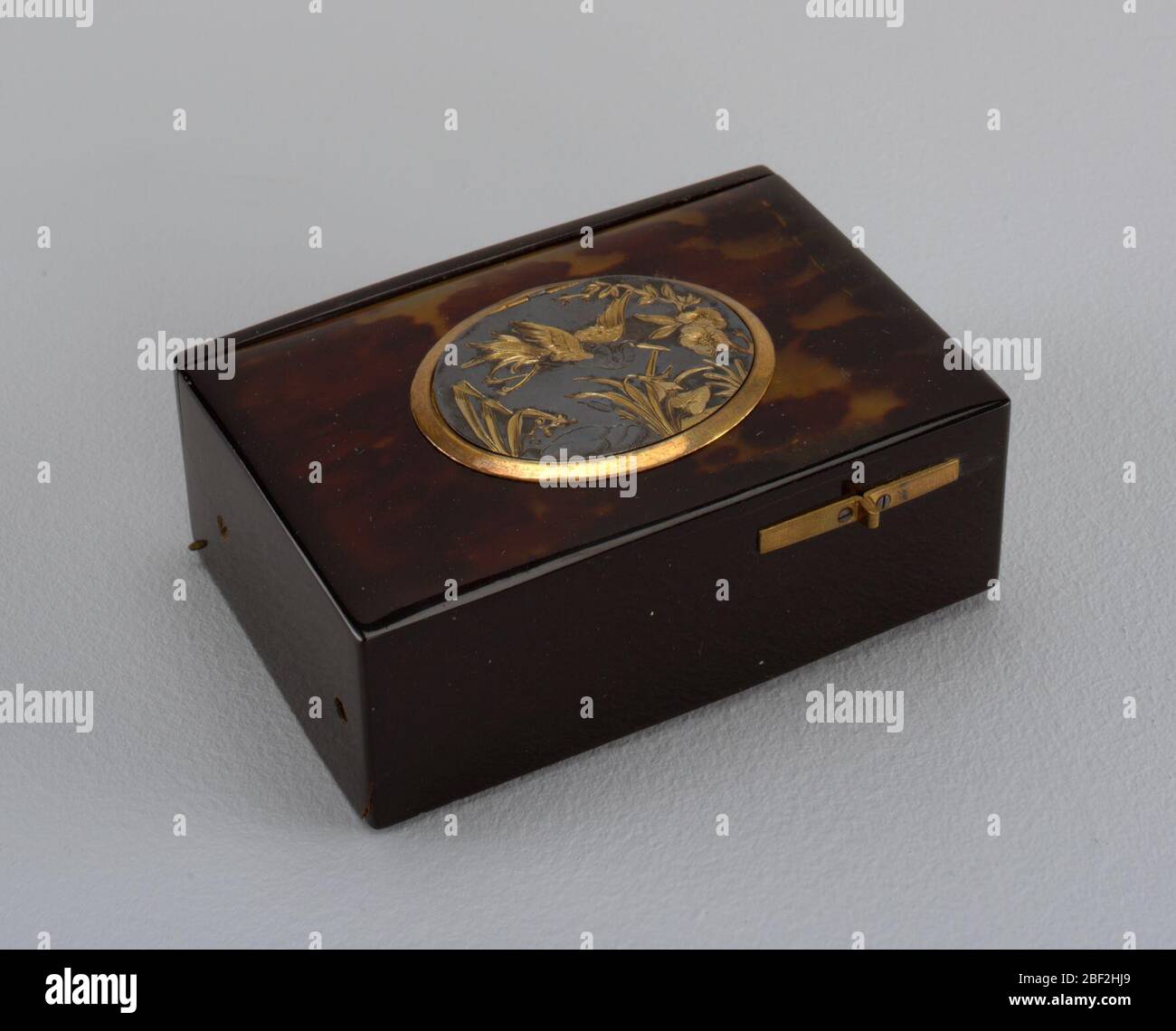 Music Box. Rectangular tortoise shell box with hinged back, containing ...