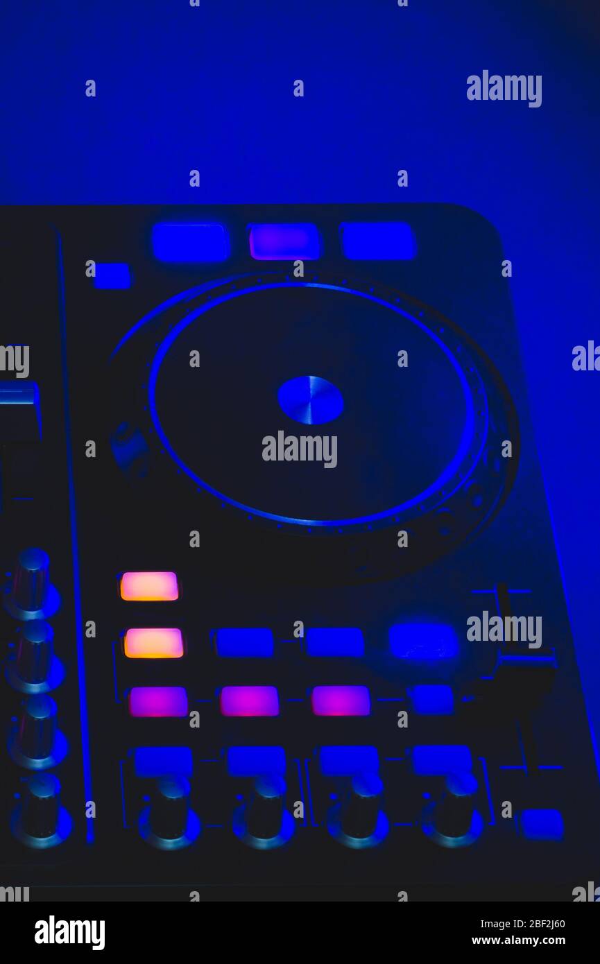 Dj sound mixer controller with knobs and sliders close up. audio mixing ...