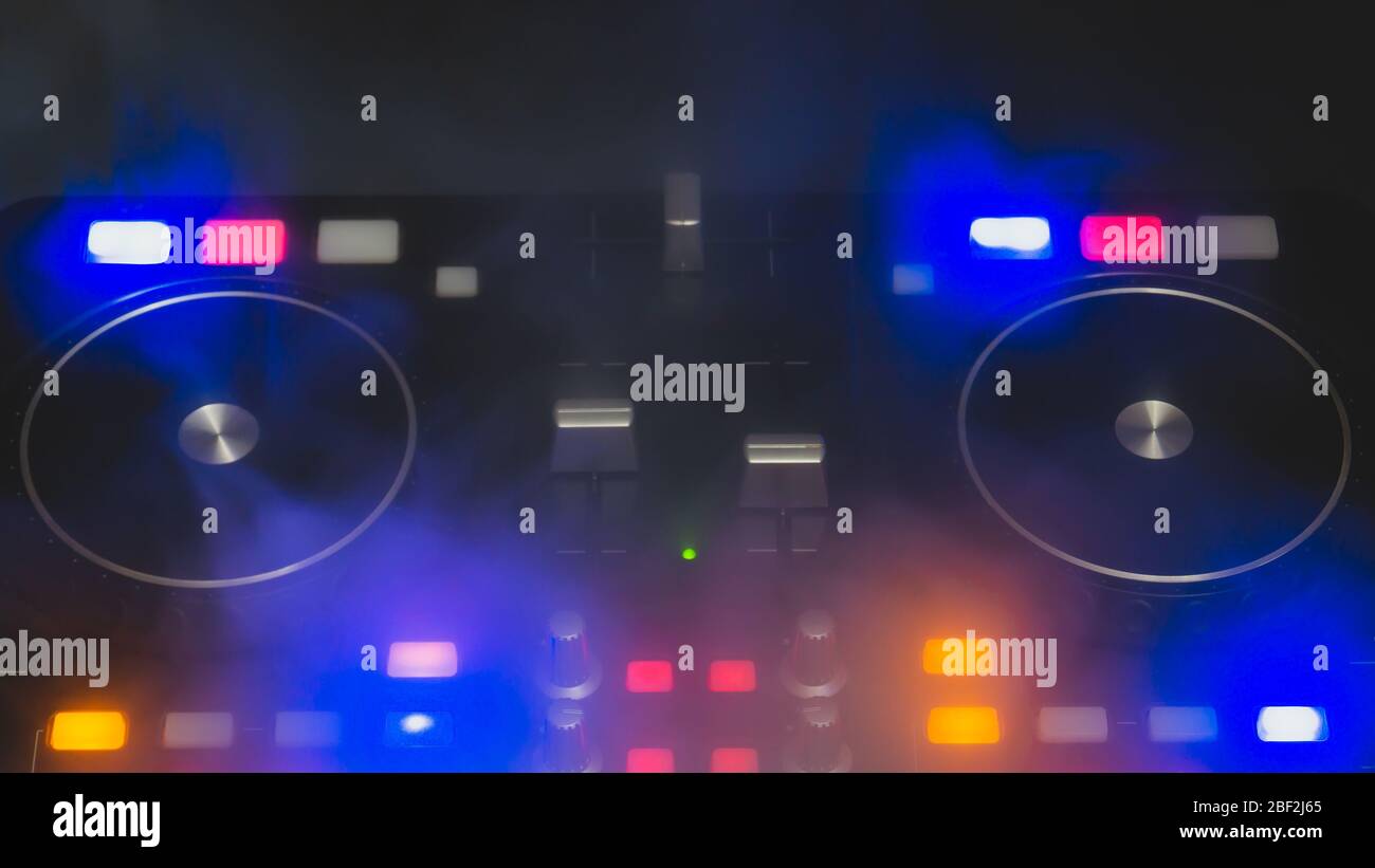 Dj sound mixer controller with knobs and sliders close up. audio mixing ...