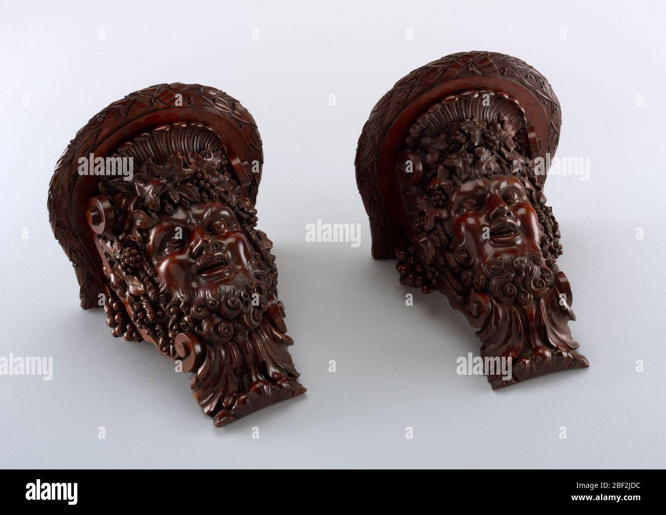 Bracket. Wall brackets with head of Bacchus. Bearded laughing mask ...