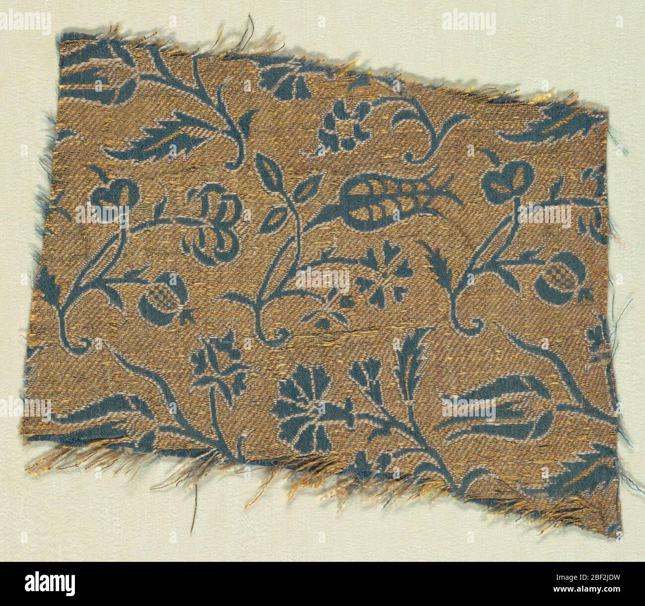 Fragment. Fragment has a ground of gold twill, nearly worn away, with a ...