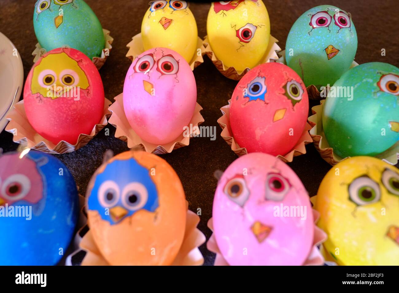 Colored Easter eggs reminiscing freshly hatched chickens Stock Photo ...