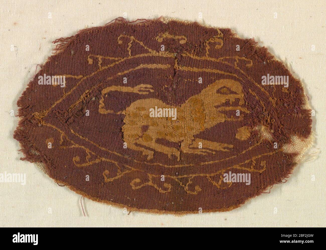 Fragment. Oval medallion, monochrome, light pattern on dark ground ...