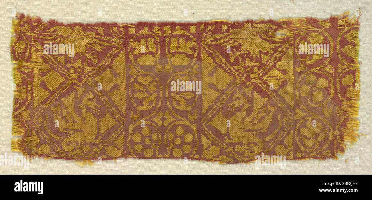 Fragment. Dark red ground with a design in yellow-green; design is ...
