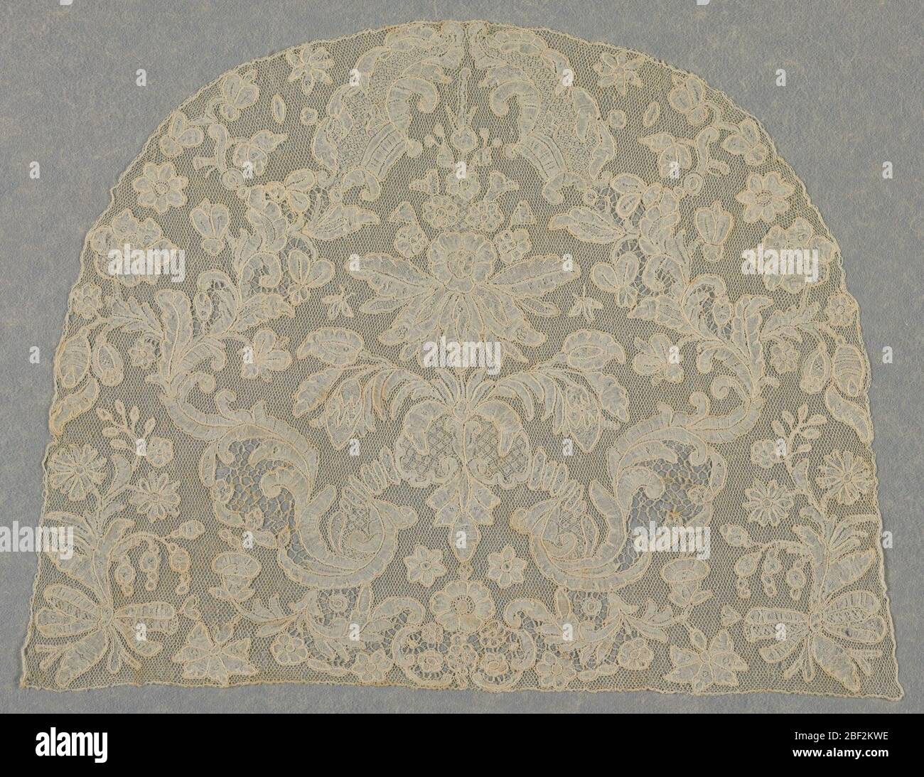 Cap crown. Cap crown with a pattern of floral and foliated forms ...