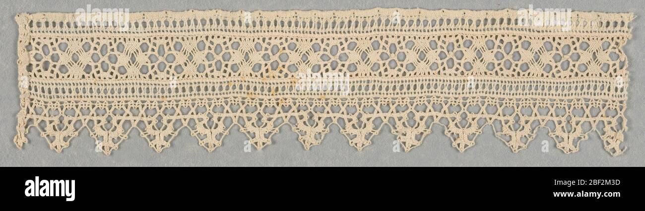 Fragment. Band fragment with triangular tab edge attached to a wide ...