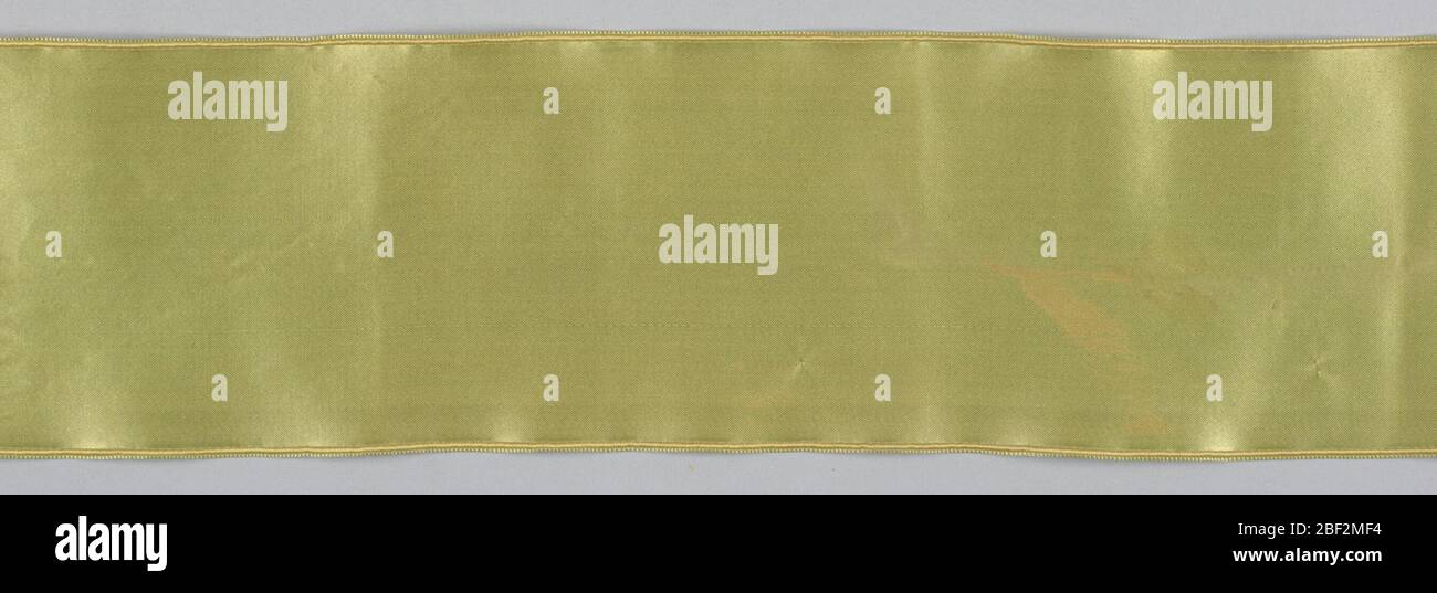 Textile. Light green satin ribbon with cord edge Stock Photo - Alamy