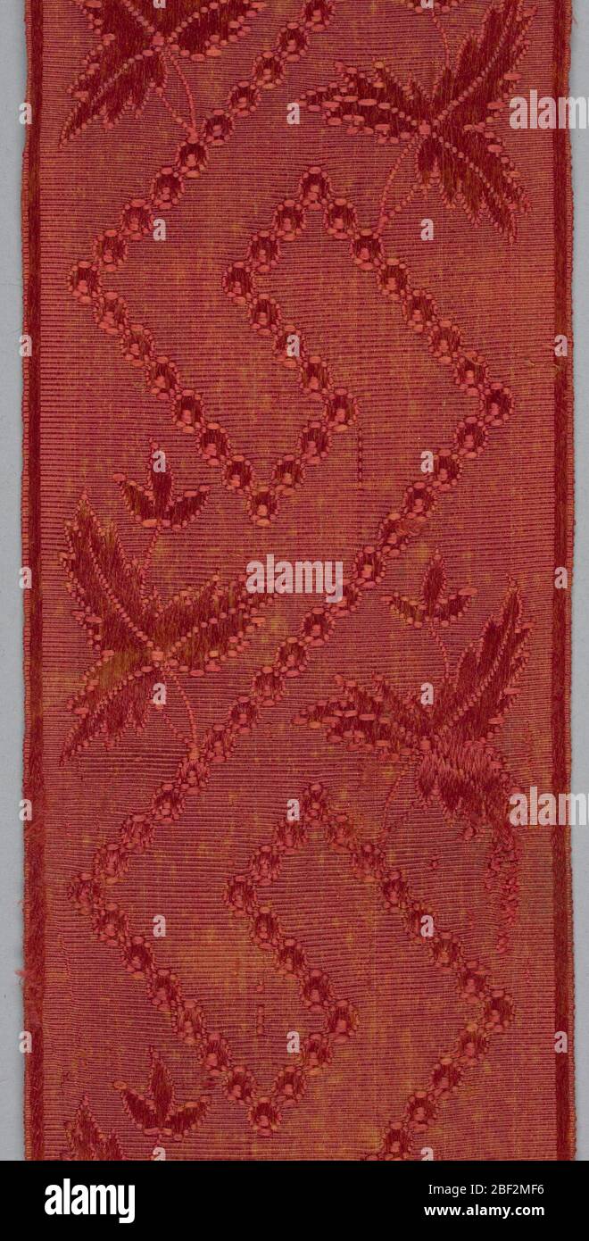 Ribbon. Red ribbon with self-color leaf and fret design Stock Photo - Alamy