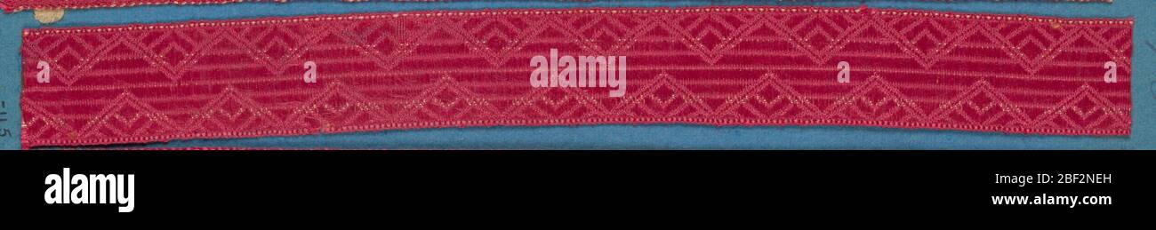 Trimming. Red trimming fragment in a broad chevron design in center ...