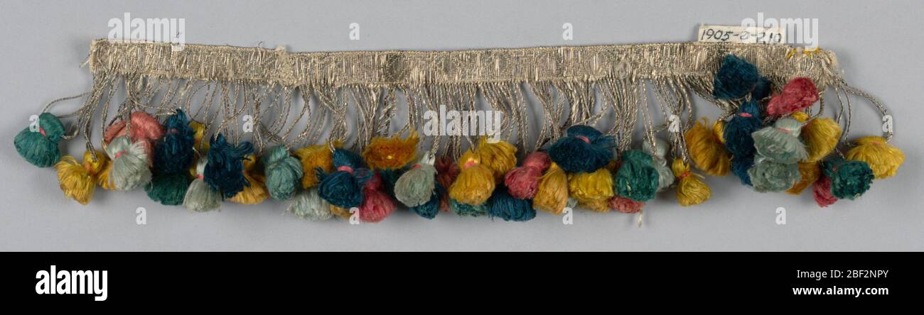 Fringe. Fringe with a silver thread heading in a lozenge design with ...