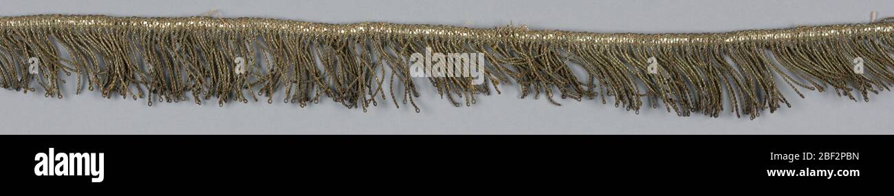 Fringe. Fringe of metallic thread with a thin woven heading and twisted ...