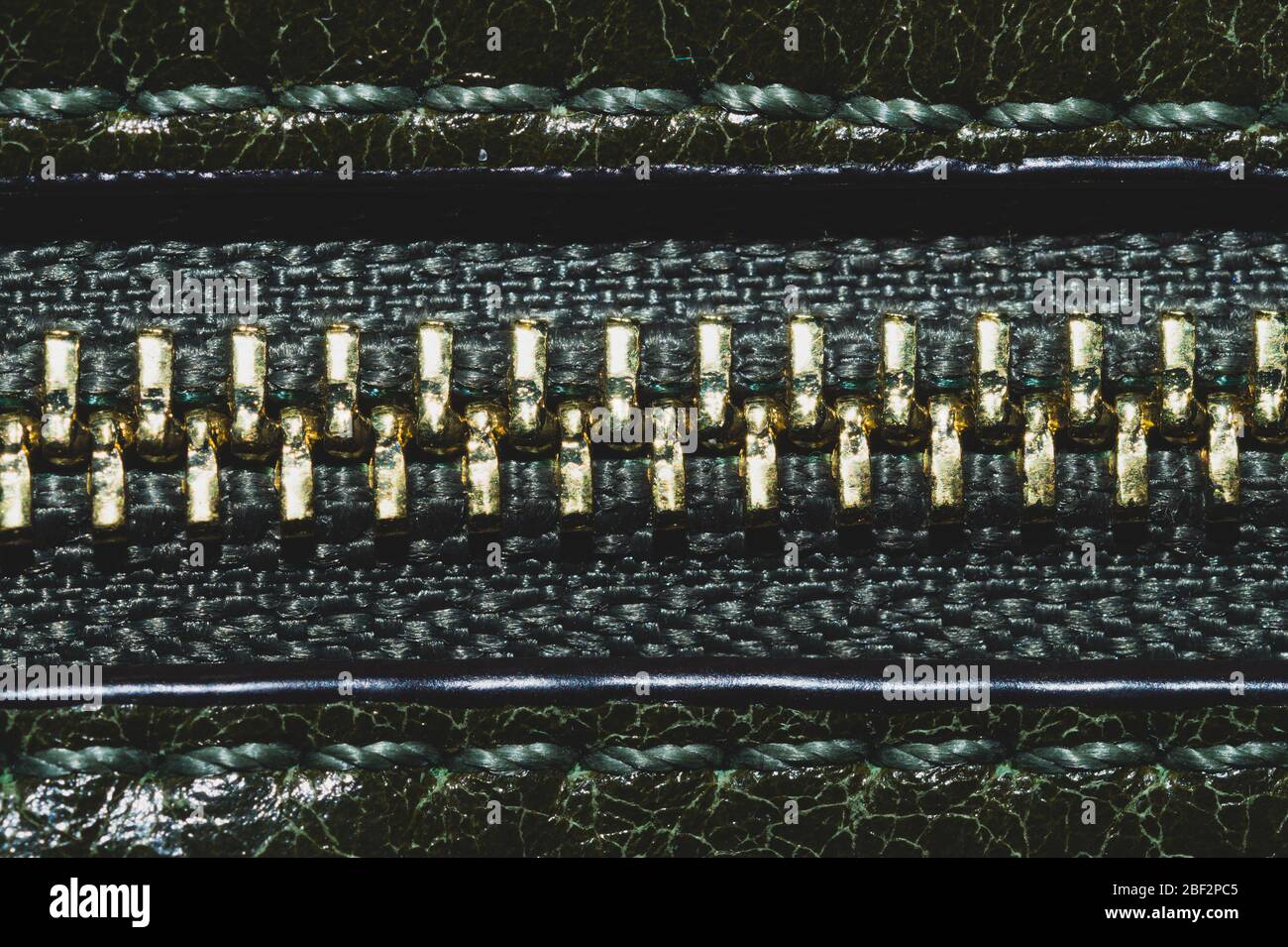 Zipper closure on the leather material close up Stock Photo - Alamy
