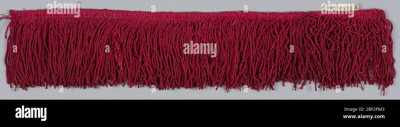 Fringe. Red fringe with an ornamental heading and a skirt of looped and ...