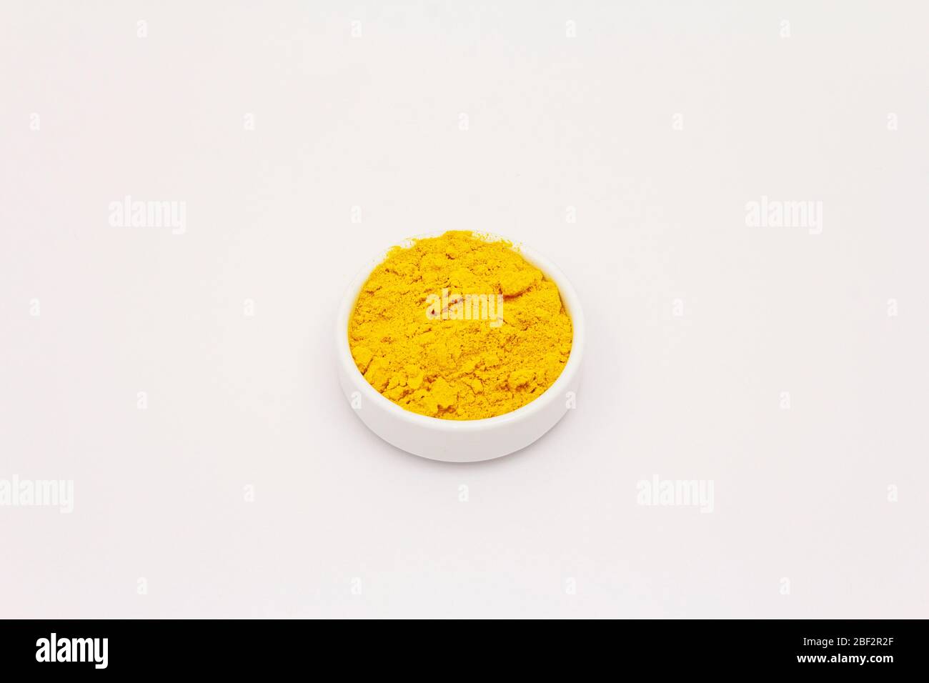 Dry turmeric powder isolated on white background. Traditional Indian ...