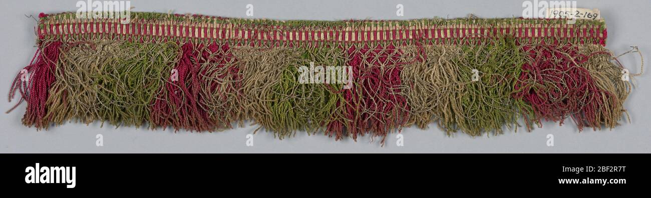 Fringe. Red, green, white and metallic silver fringe with a heading in ...