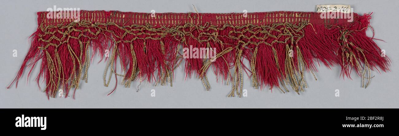 Fringe. Red and metallic gold fringe with a woven heading in a trellis ...